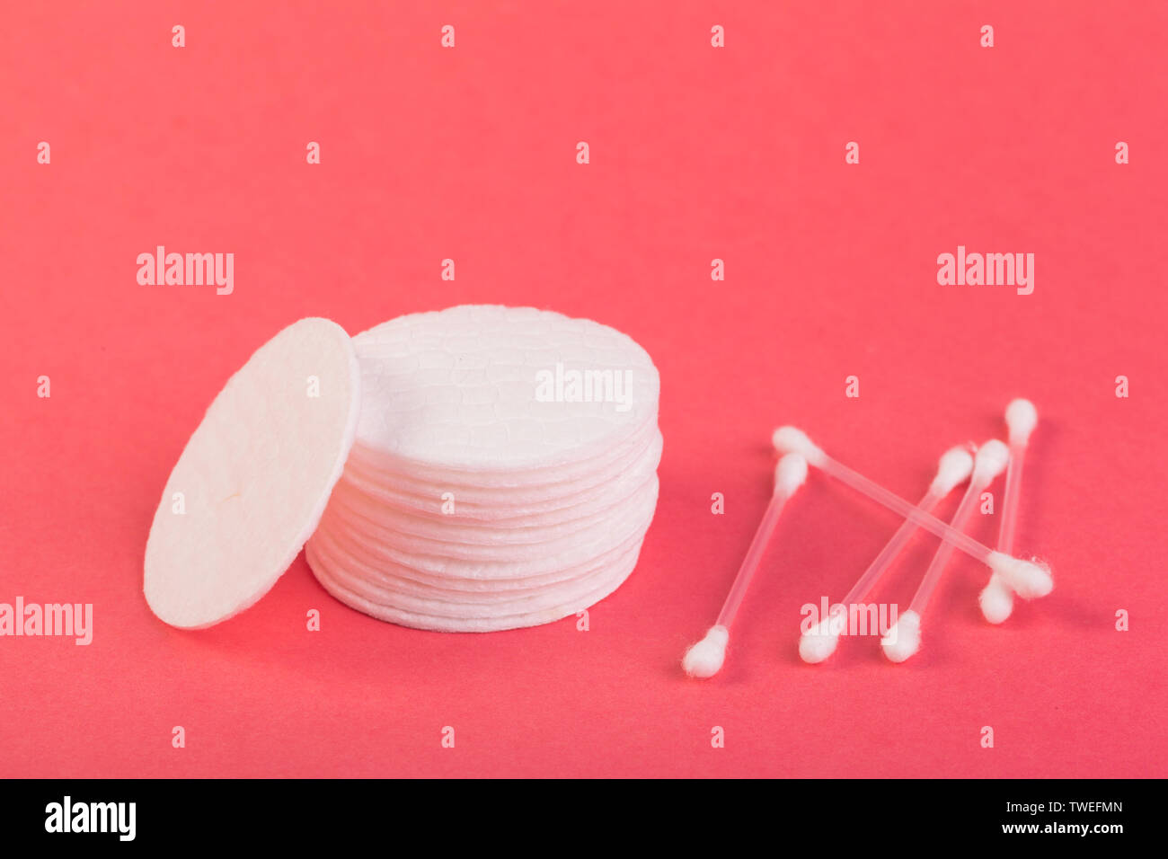 cotton pads stack on colored background Stock Photo - Alamy