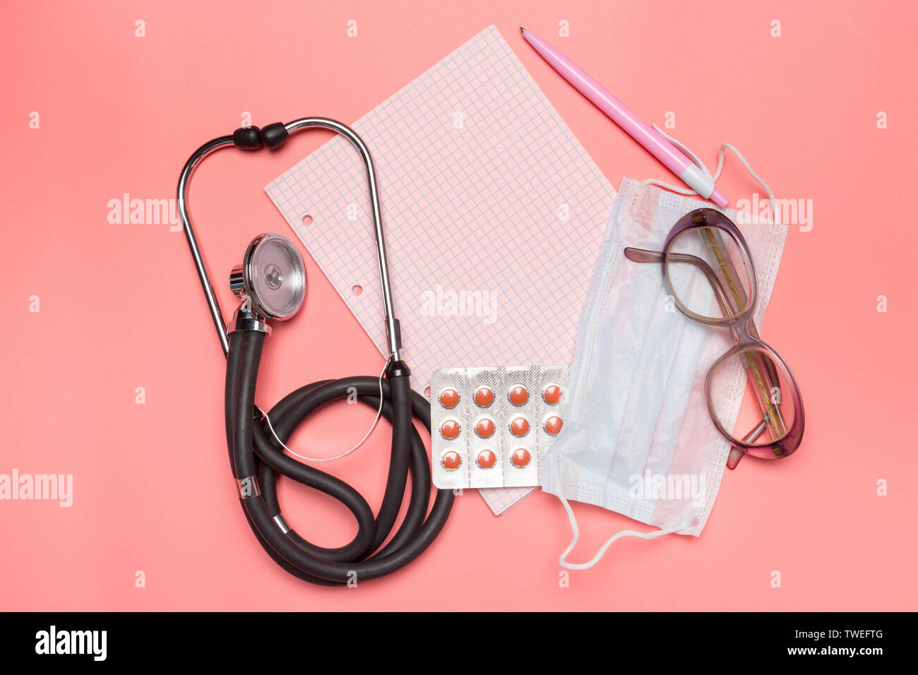 Medical equipment on a pink pastel background Stock Photo - Alamy