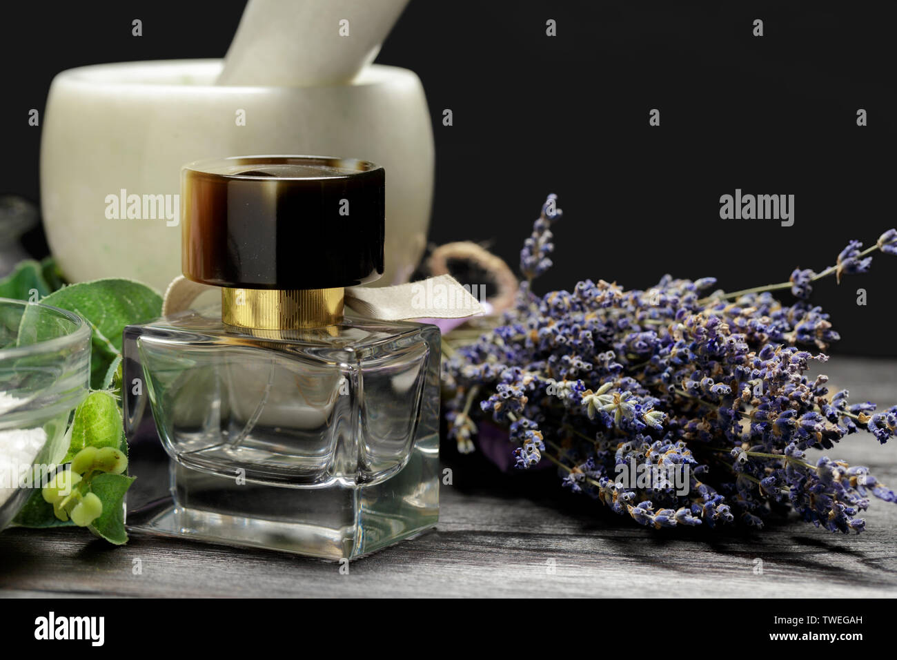 Aromatic composition of lavender, herbs, cosmetics and salt on a dark ...