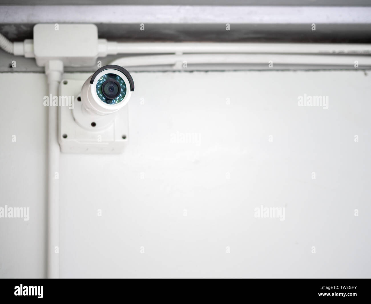 White CCTV camera on white wall background. Modern CCTV security camera ...