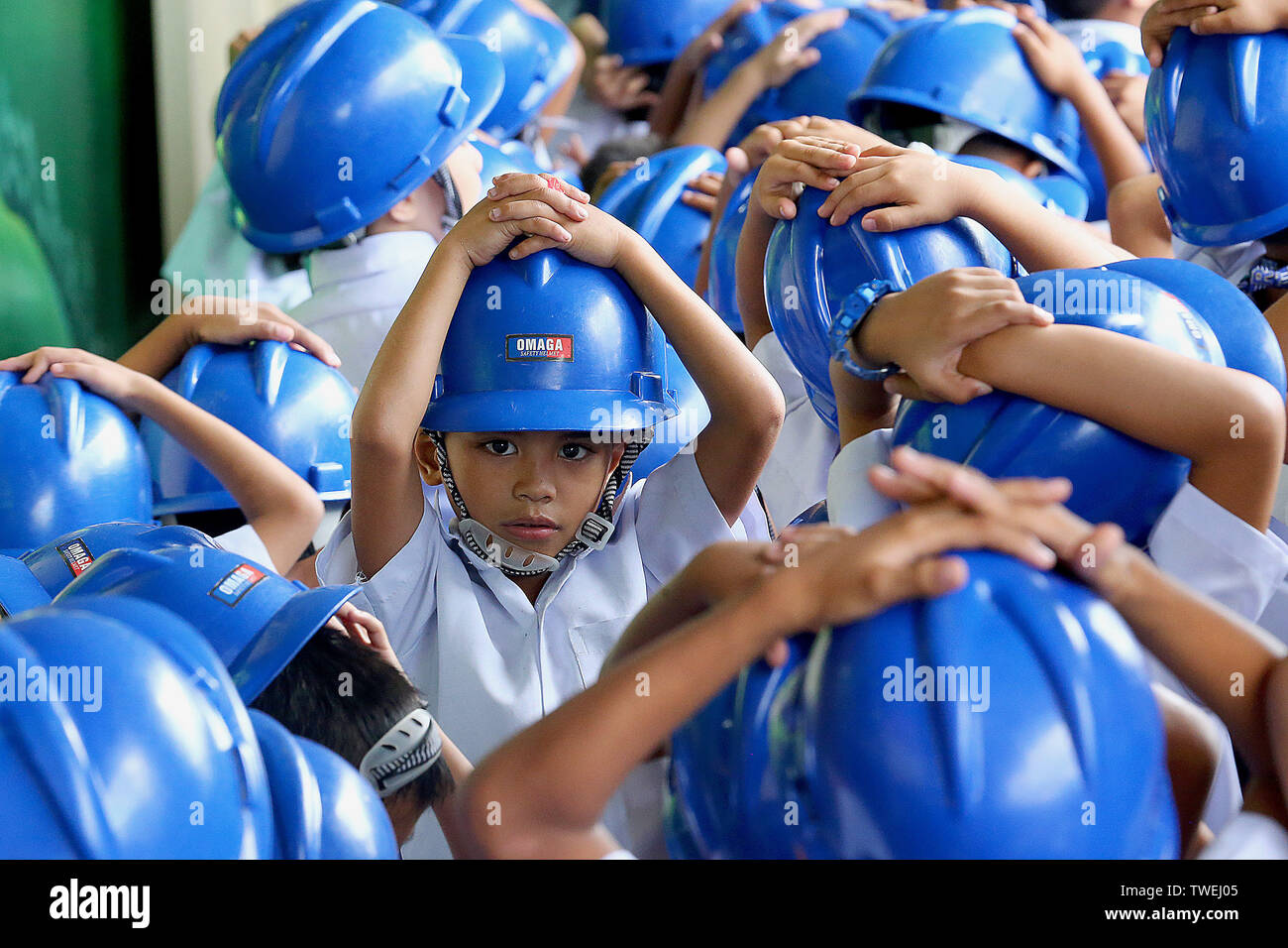 Quezon City, Philippines. 20th June, 2019. Students wearing hard hats ...