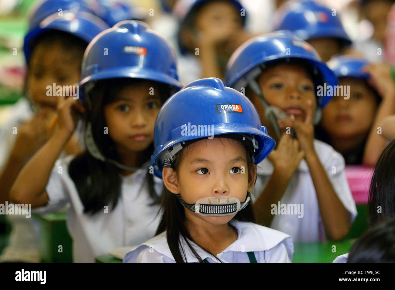 Quezon City, Philippines. 20th June, 2019. Students wearing hard hats ...