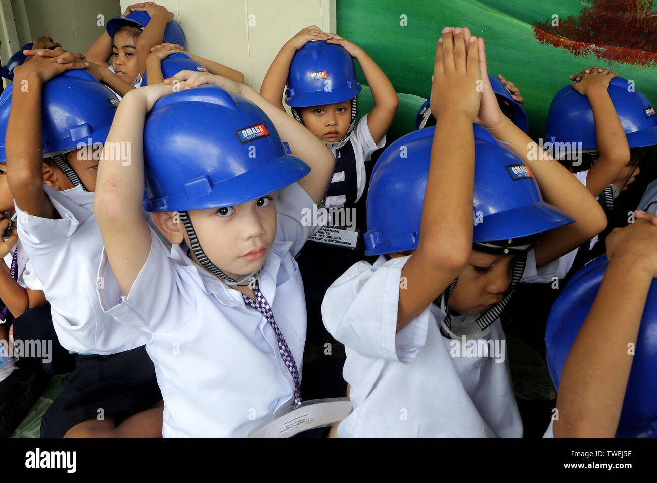 Quezon City, Philippines. 20th June, 2019. Students wearing hard hats ...