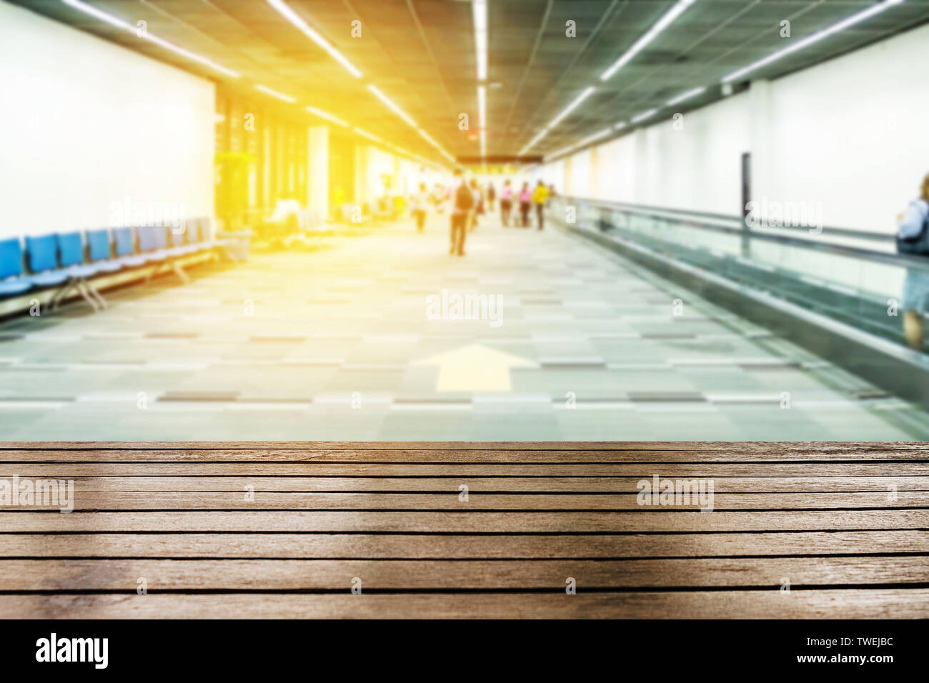Wood table top on blurred passengers walking to gate in airport Stock ...