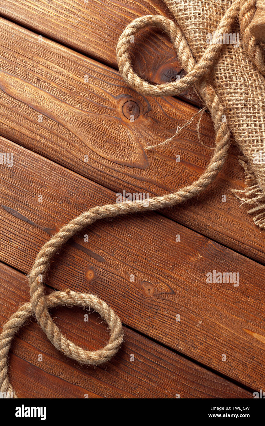 ship rope at wooden background Stock Photo - Alamy