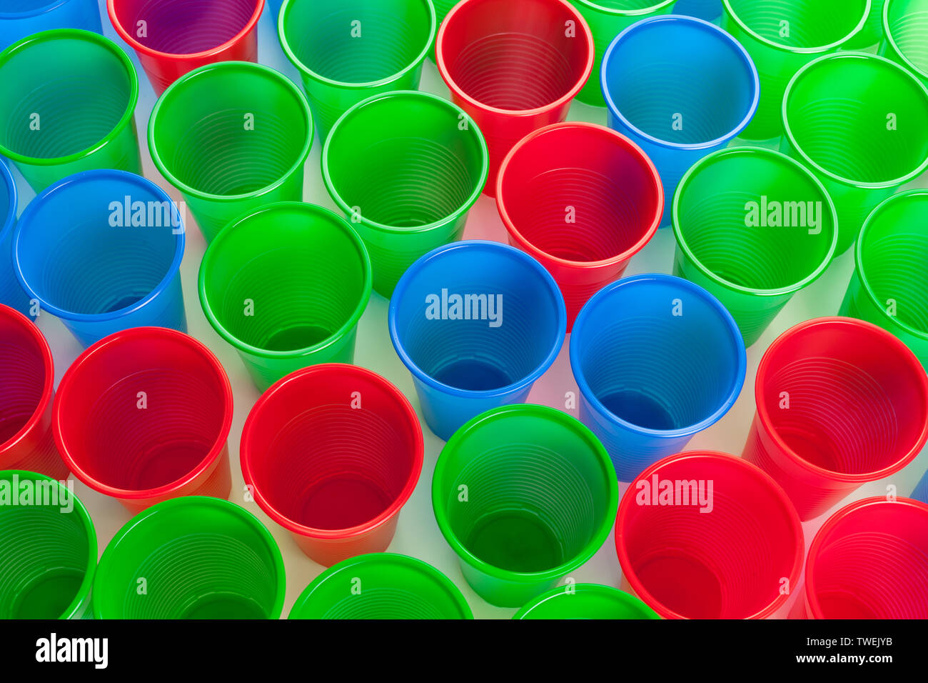Multicolor plastic glasses isolated on white background Stock Photo - Alamy