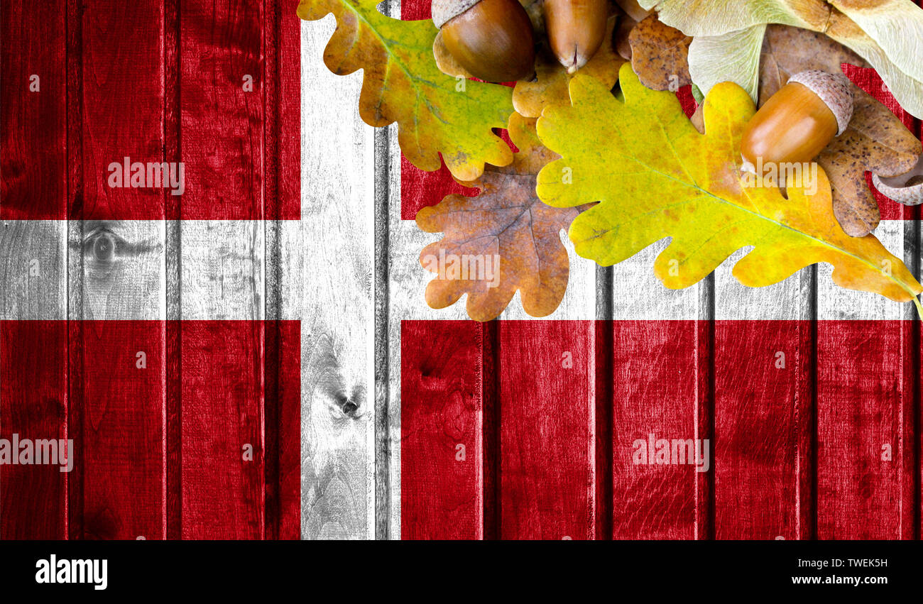 Denmark flag on autumn wooden background with leaves and good place for ...