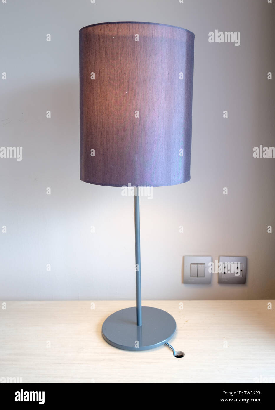 Brown desk lamp on wooden table Stock Photo - Alamy