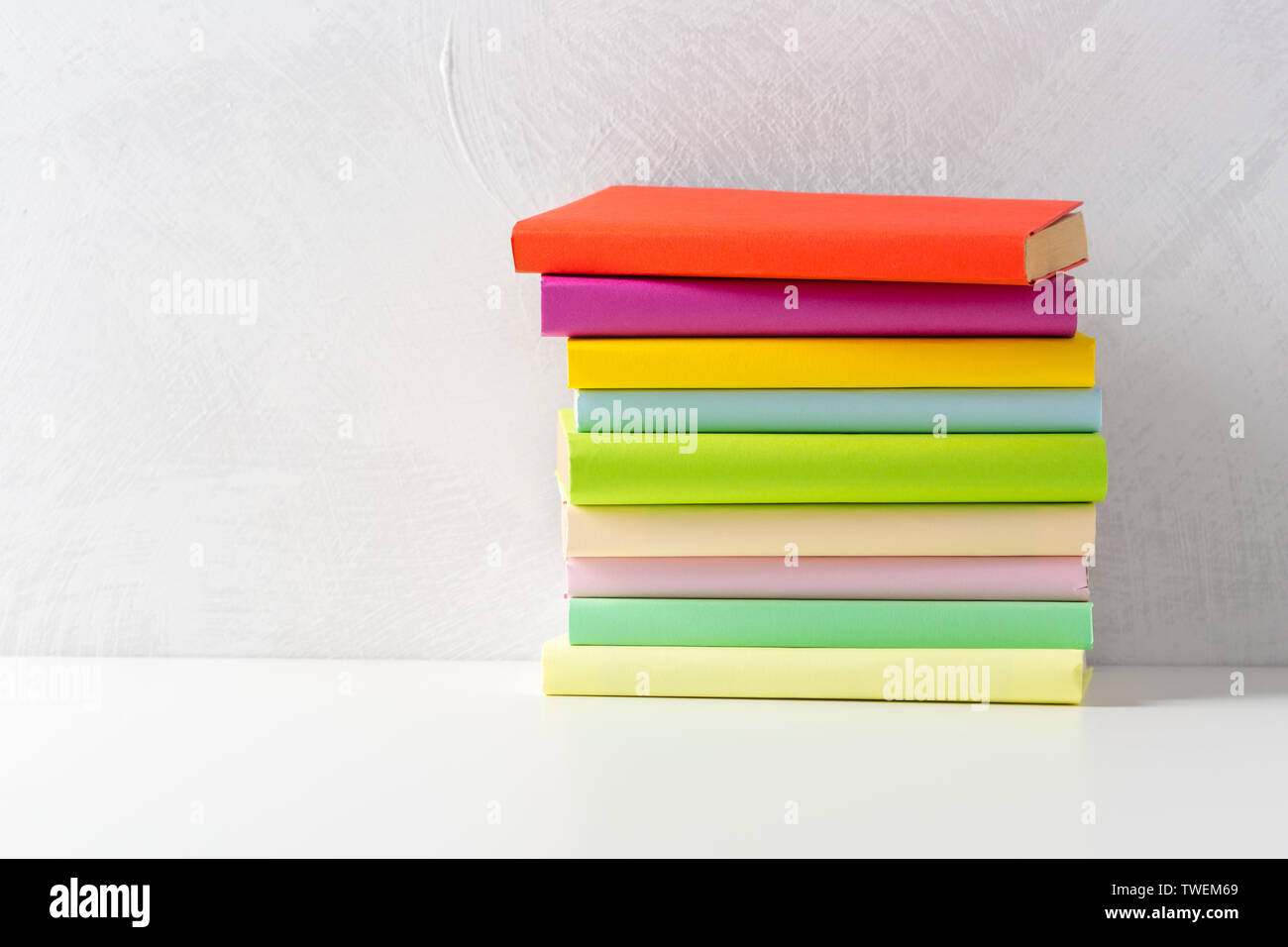 pile of paperback books on a table Stock Photo - Alamy