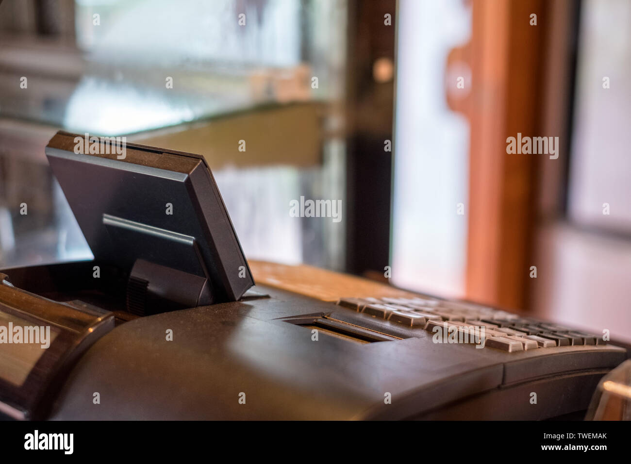 Empty cash register on counter desk Stock Photo - Alamy