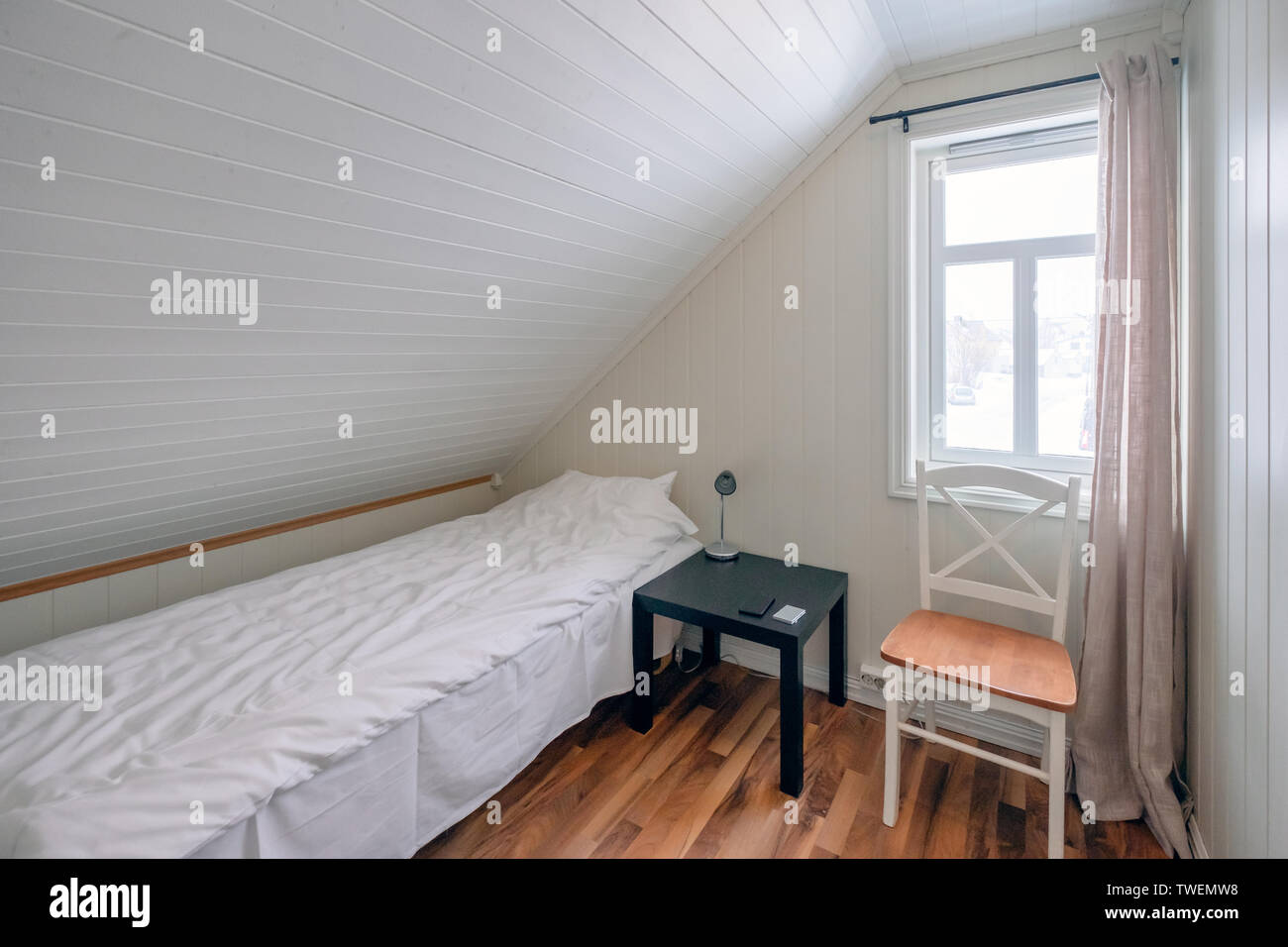 Interior bedroom roof tilted with curtain window in winter season Stock ...