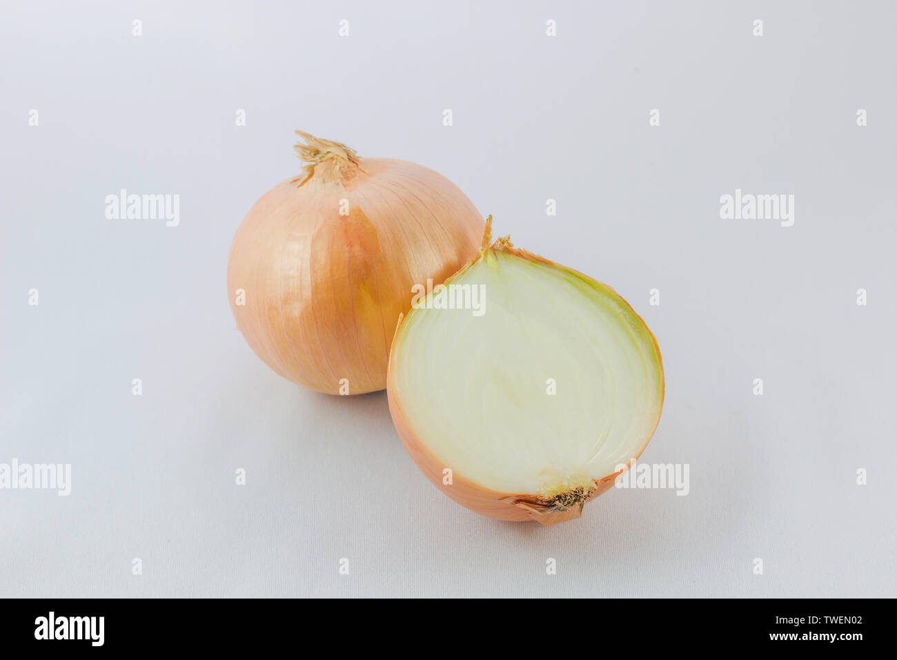 Fresh onion bulbs isolated on white background Stock Photo - Alamy