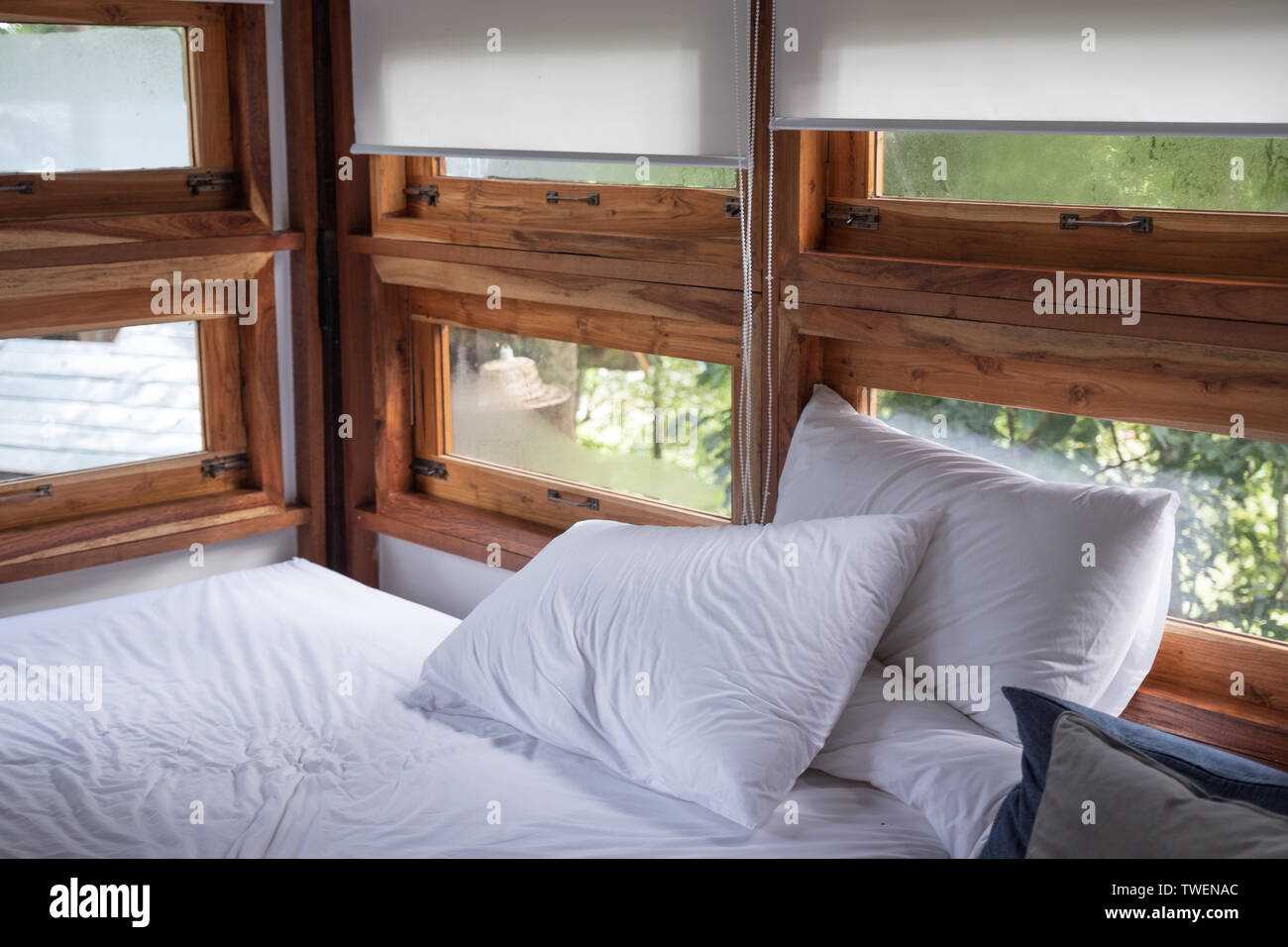 Interior cozy bedroom after waking up in wooden house at morning Stock ...