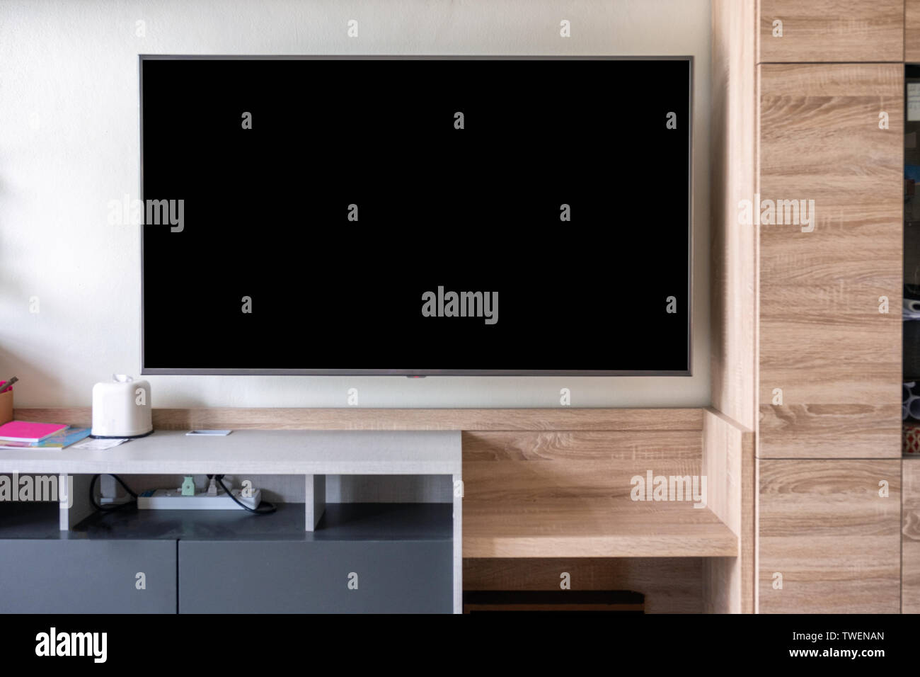 LED Flat Screen TV hanging on wooden closet Stock Photo - Alamy
