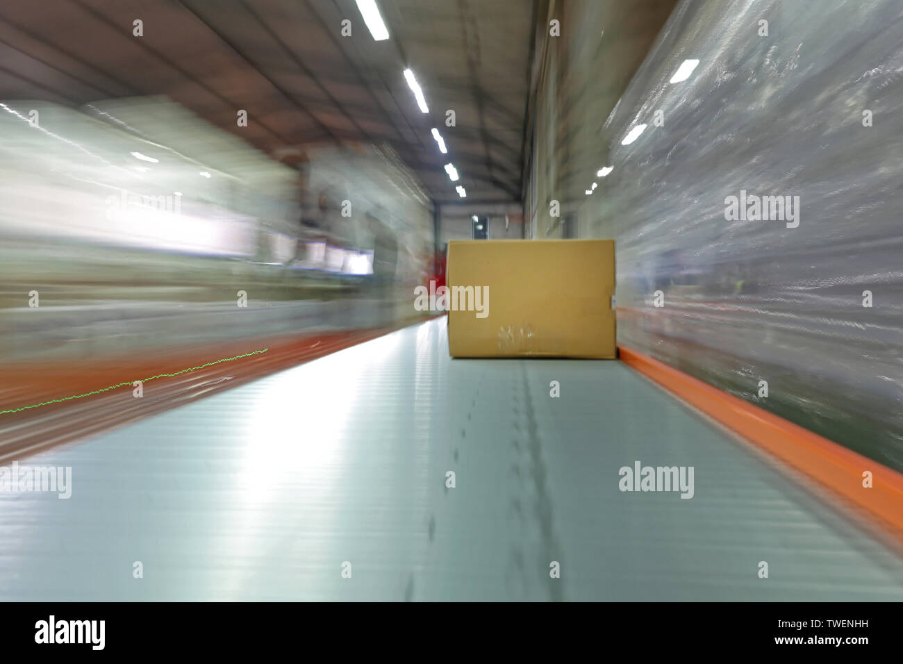 Shipping Boxes at Conveyor Belt in Distribution Warehouse Stock Photo ...