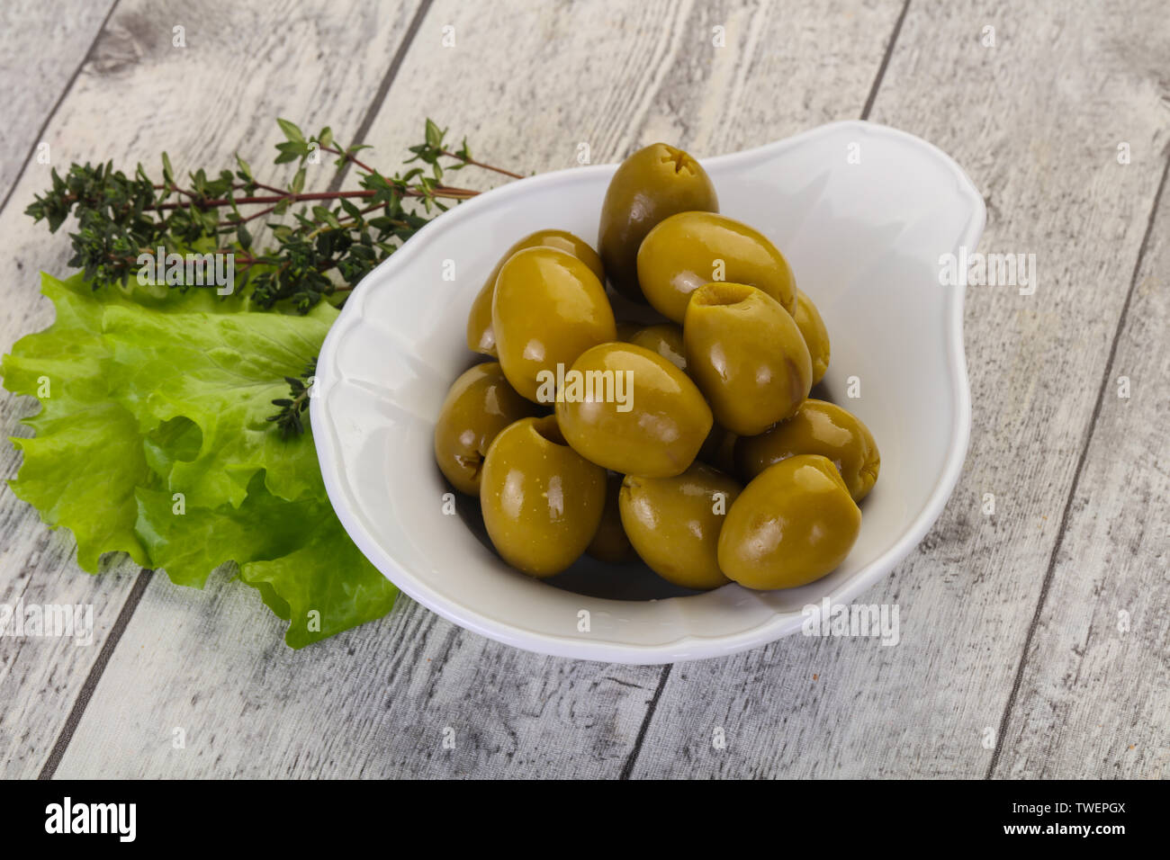 Big green olives in the bowl Stock Photo - Alamy