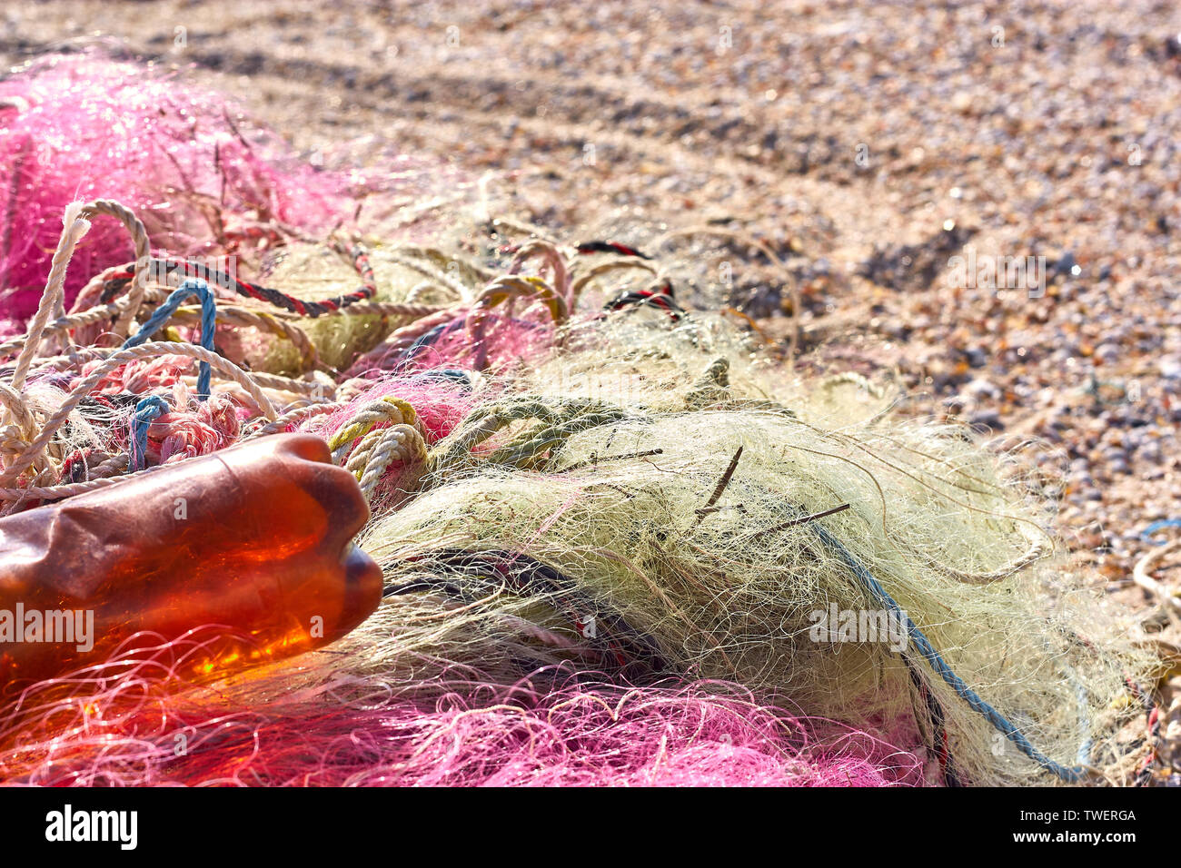 A tangled mess of fishing nets plastic rope and other debris washed up ...