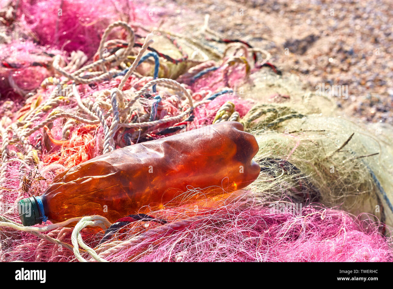 A tangled mess of fishing nets plastic rope and other debris washed up ...