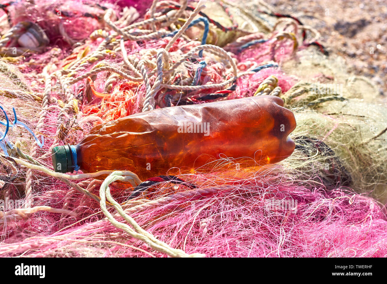 A tangled mess of fishing nets plastic rope and other debris washed up ...