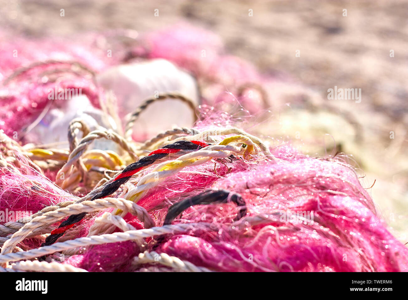 A tangled mess of fishing nets plastic rope and other debris washed up ...