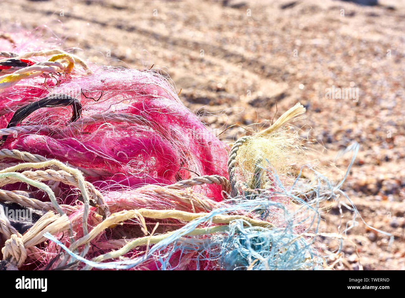 A tangled mess of fishing nets plastic rope and other debris washed up ...