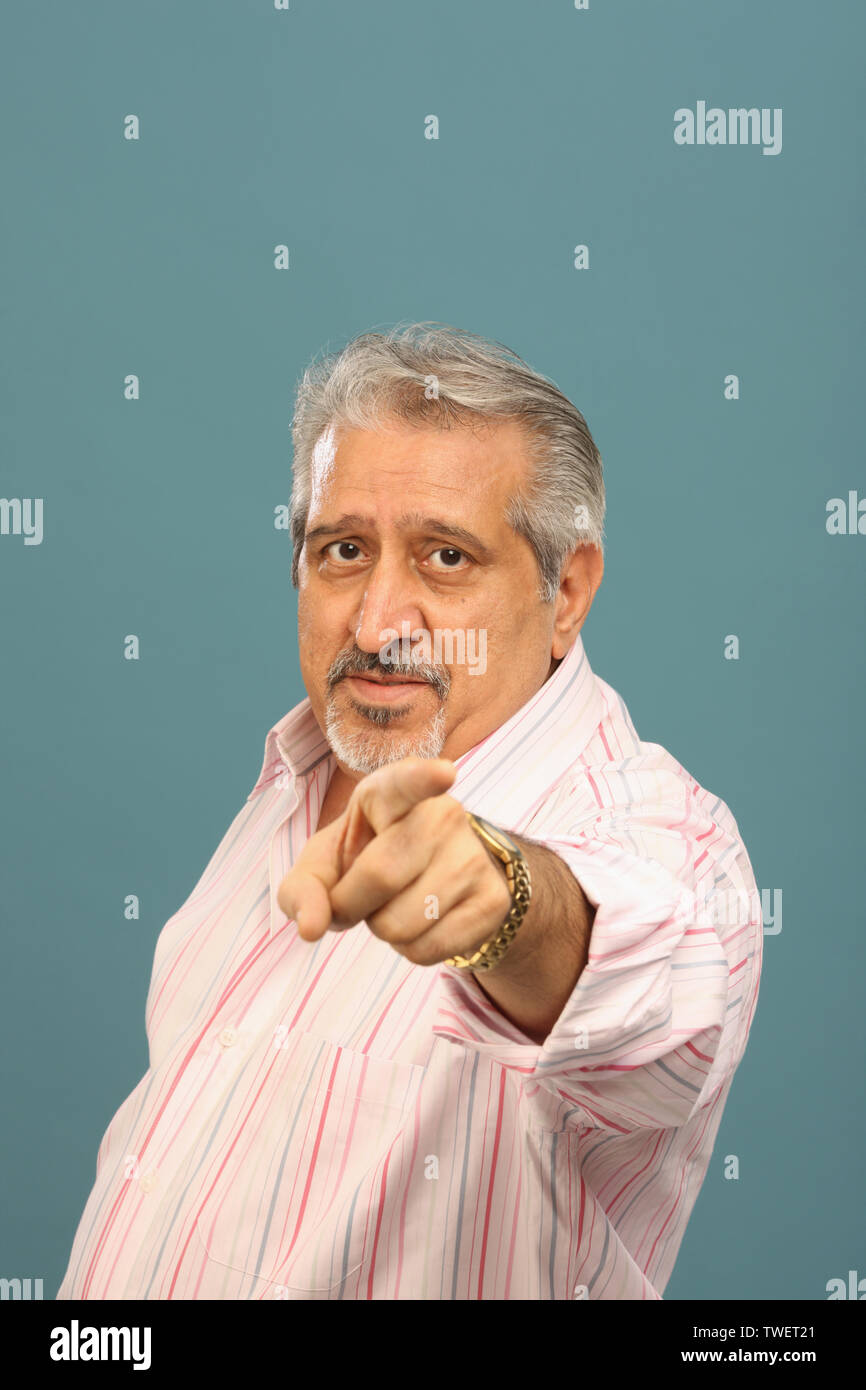 Portrait of an Indian old man pointing toward camera Stock Photo - Alamy