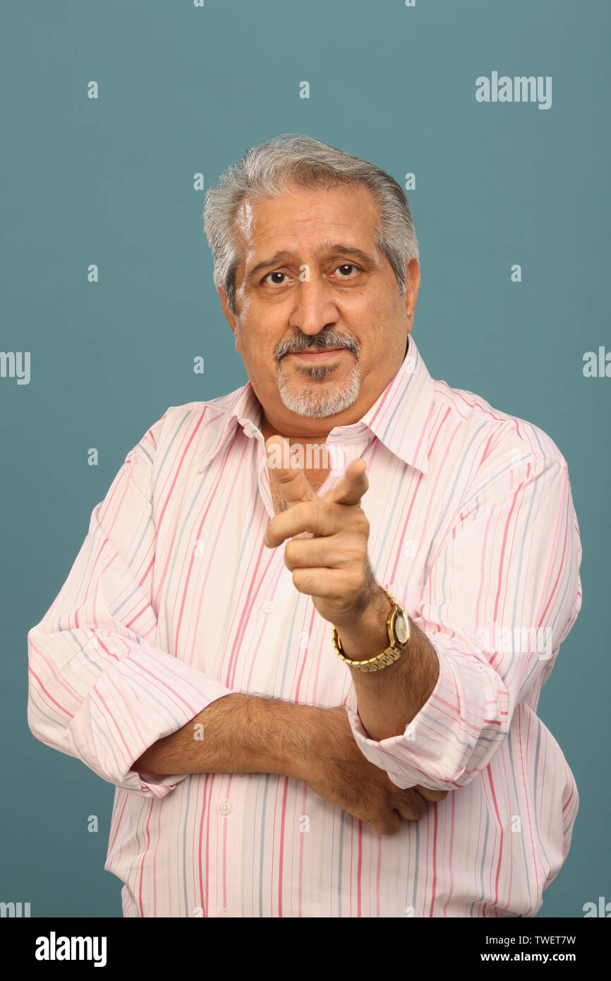 Portrait of an old man pointing toward camera Stock Photo - Alamy