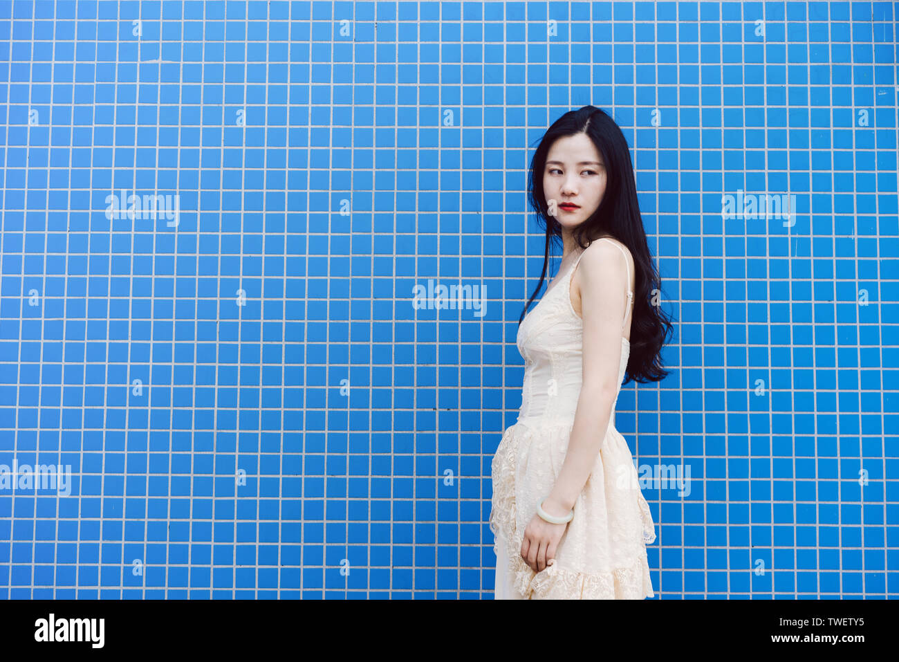 Beautiful girl on solid color background Stock Photo - Alamy