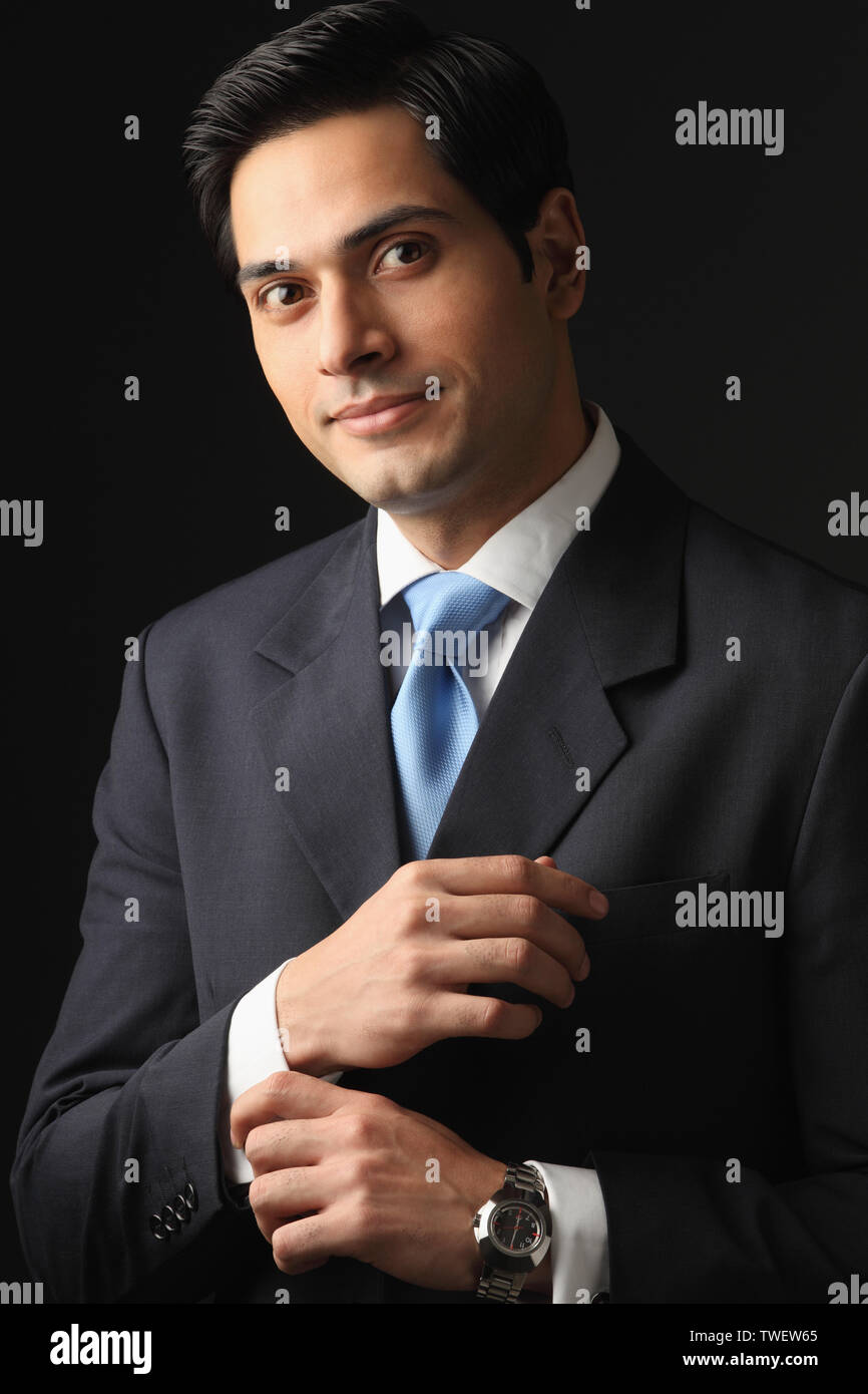 Businessman adjusting cuffs hi-res stock photography and images - Alamy