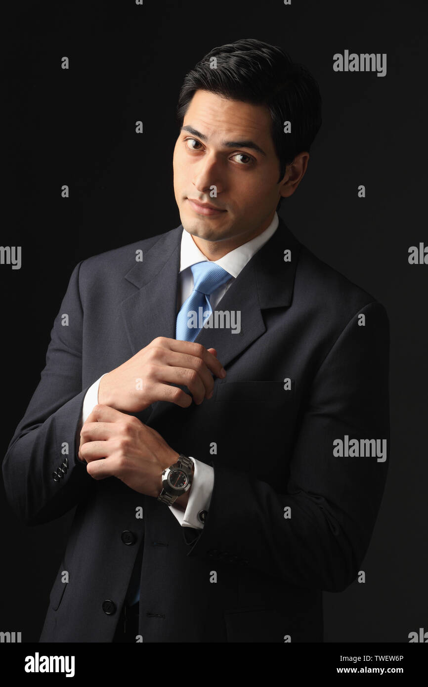 Businessman adjusting his cuffs hi-res stock photography and images - Alamy