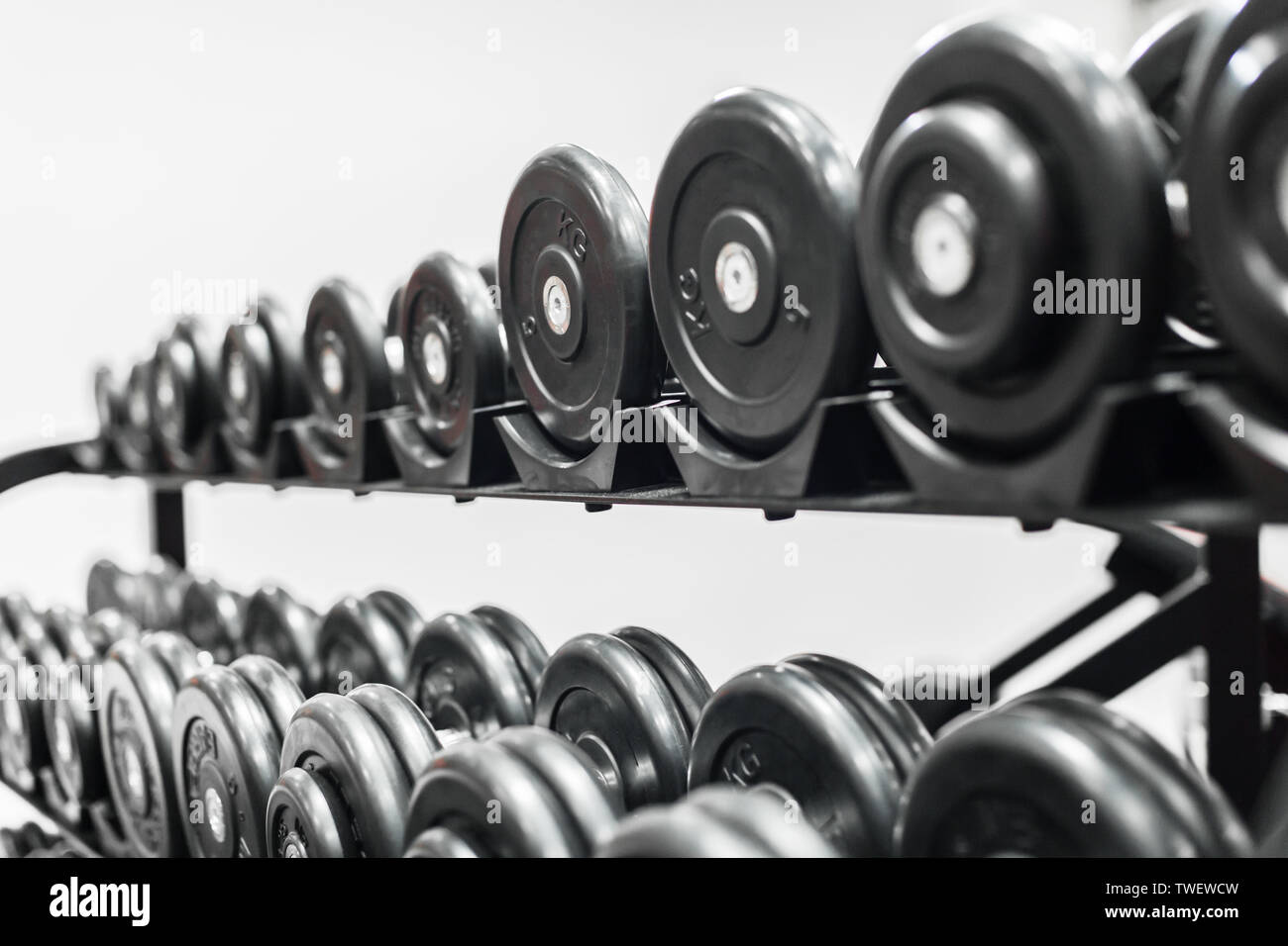 Dumbbells in the gym Stock Photo - Alamy