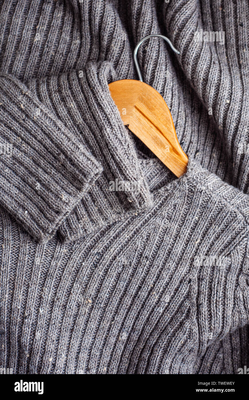 Wear from warm gray wool. Dress of natural rustic knitting Stock Photo ...