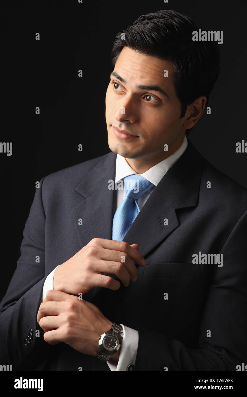 Businessman adjusting his cuffs hi-res stock photography and images - Alamy