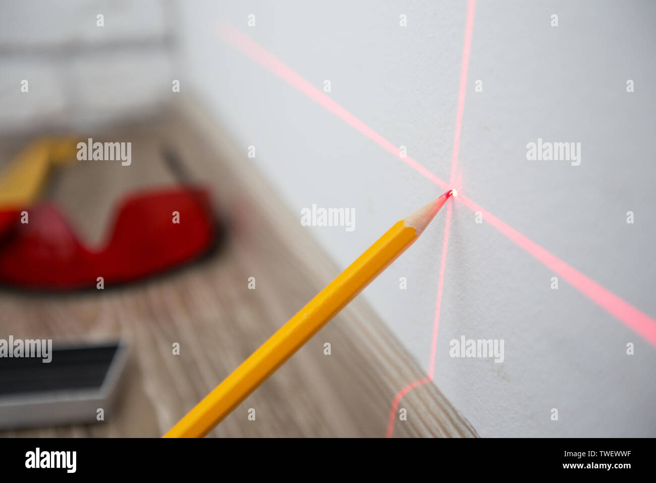 Laser level and lines on the wall Stock Photo - Alamy