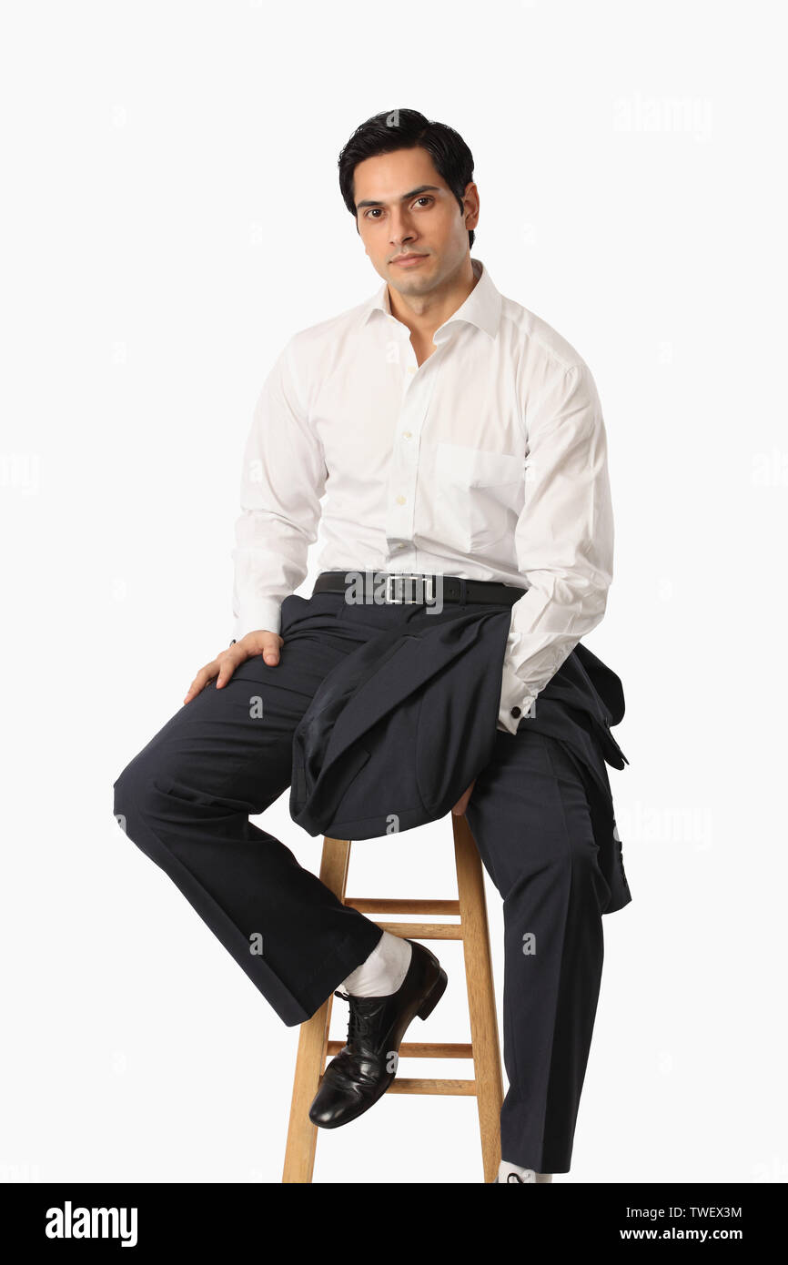 Employee sitting on stool Cut Out Stock Images & Pictures - Alamy