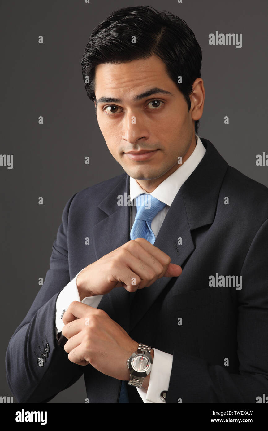 Businessman adjusting cuffs hi-res stock photography and images - Alamy