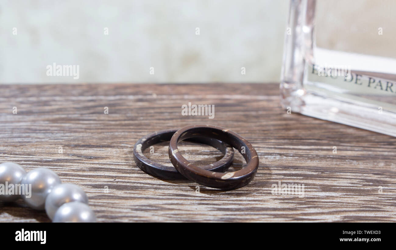 Unique artisan wedding rings, handmade from coconut in wooden table ...