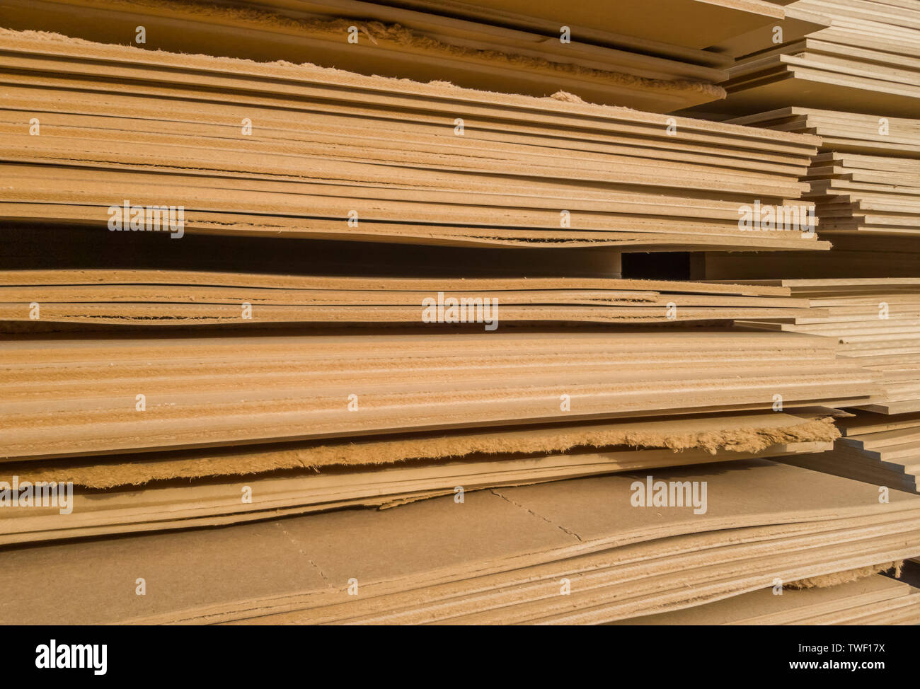 Stacks of old MDF of poor quality. Selective focus Stock Photo - Alamy