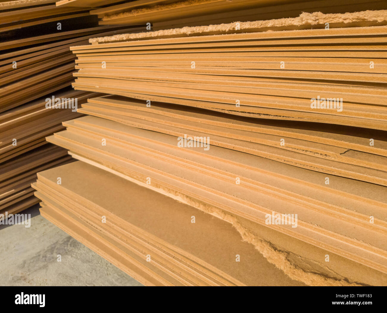 Stacks of old MDF of poor quality. Selective focus Stock Photo - Alamy