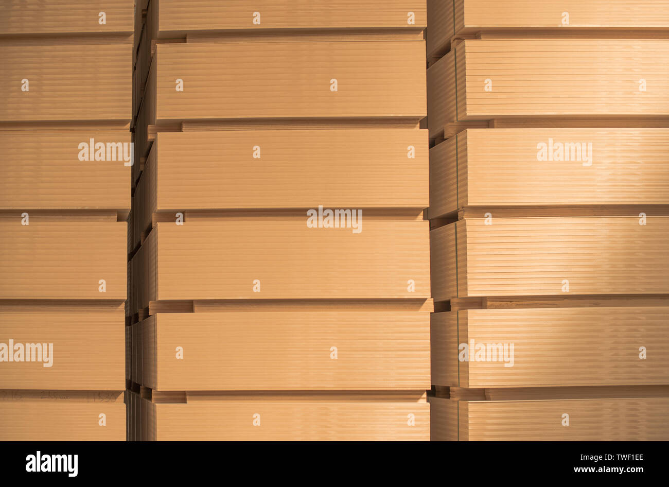 A wall of packs of chipboard Stock Photo - Alamy
