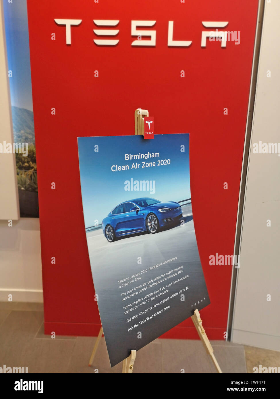 Tesla sales branch in Touchwood Solihull, UK, shows a sign for ...