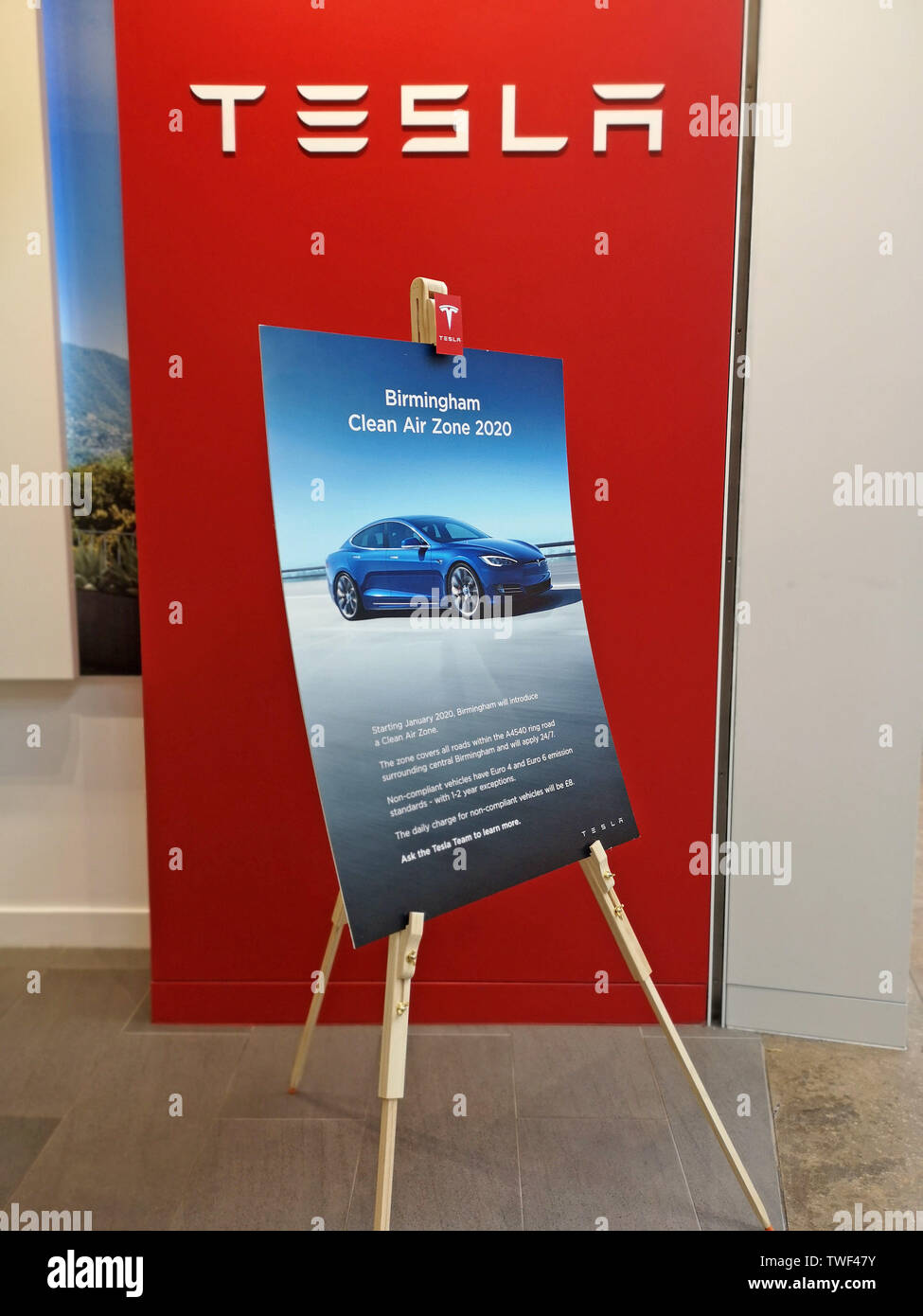 Tesla sales branch in Touchwood Solihull, UK, shows a sign for ...