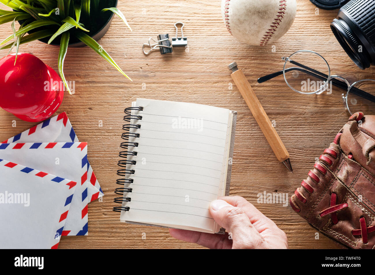 wooden desktop with blank notebook paper background Stock Photo - Alamy