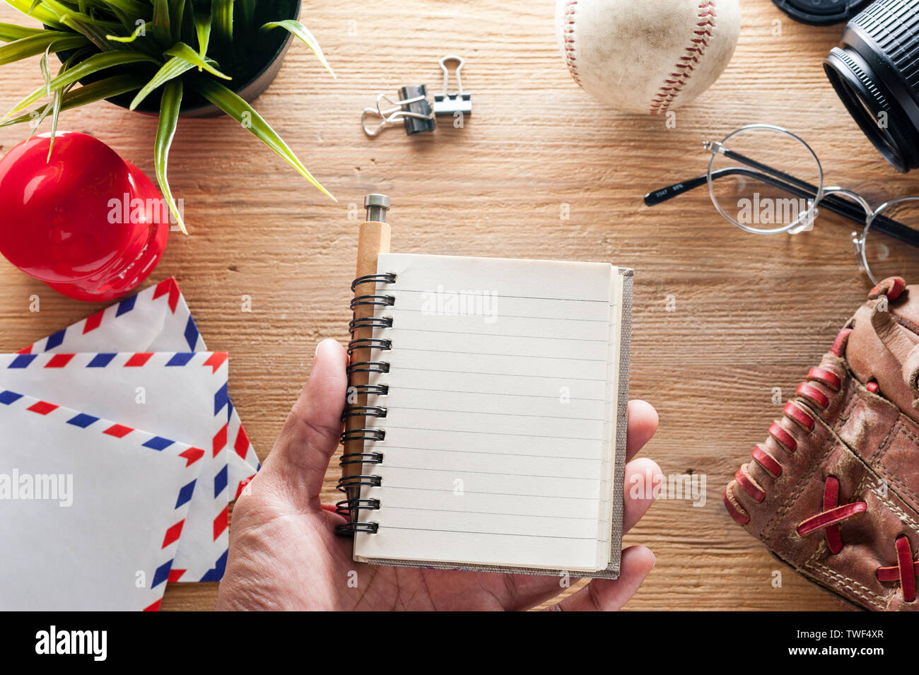 wooden desktop with blank notebook paper background Stock Photo - Alamy