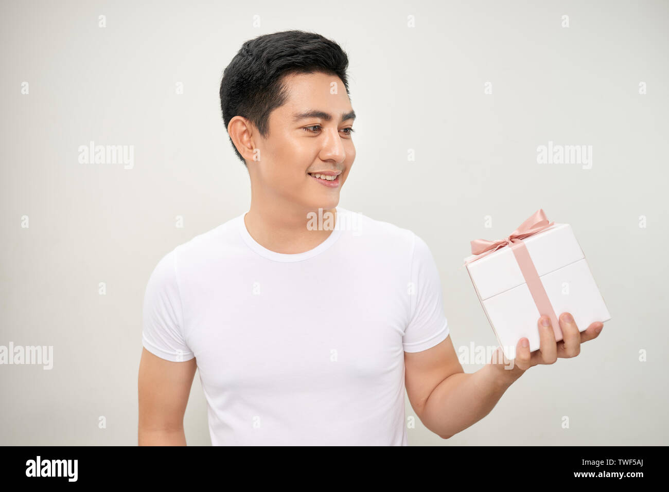Man holding present box hi-res stock photography and images - Alamy