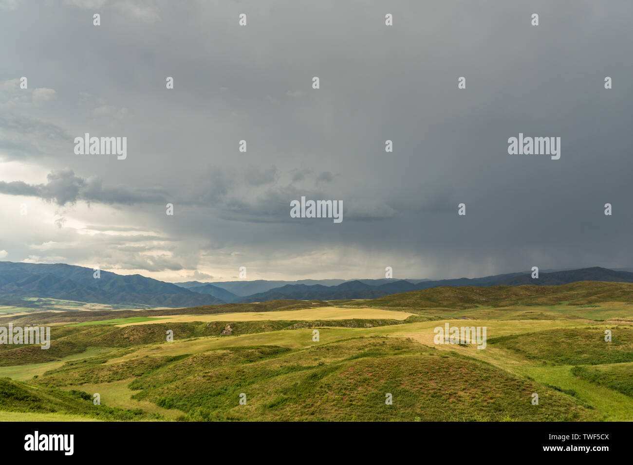 Hillside prairie villages under cloudy clouds Stock Photo - Alamy