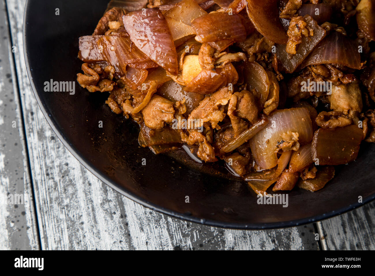 Onion fried meat Stock Photo - Alamy