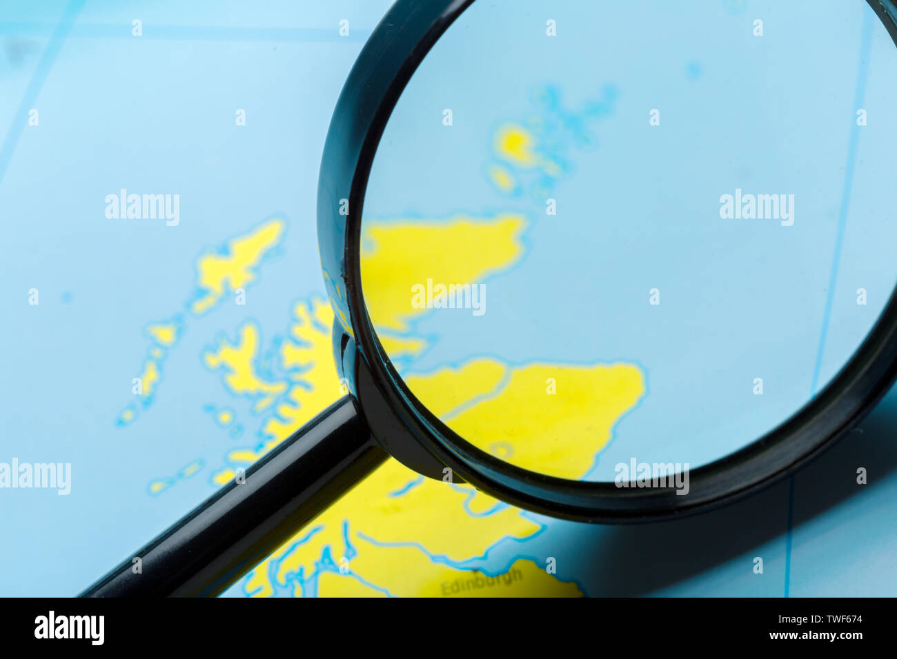 Magnifying glass and map Stock Photo - Alamy
