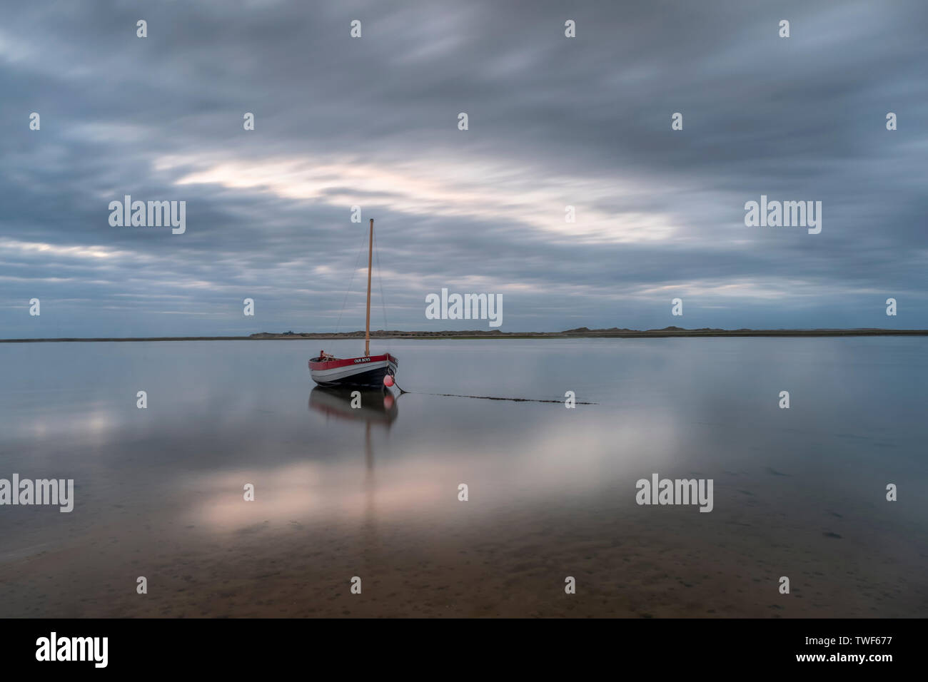 A single boat at Morston point Stock Photo - Alamy