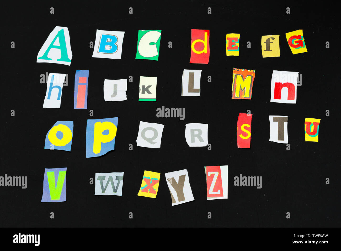 Colorful newspaper alphabet isolated on black Stock Photo - Alamy